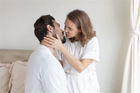 Young Couple In A Relationship Kissing And Cuddling Happy Couple Hug