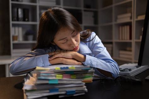 Company Employees Working Overtime After Work Working Overtime After Working Hours Due To Heavy