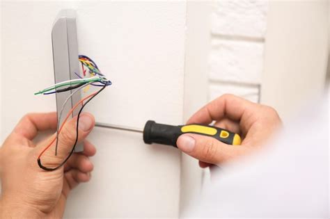 Premium Photo Male Technician Installing Security Alarm System Indoors Closeup