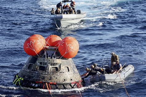 Lunar Flyby Nasas Orion Capsule Parachutes Home Safely After