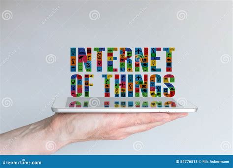 Internet Of Things Iot Concept Background With Hand Holding Tablet And Floating Text In