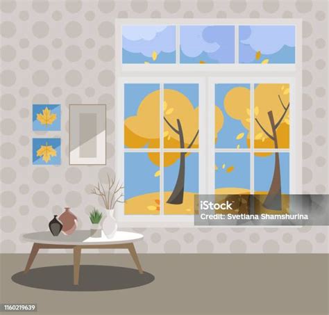 노란 나무와 날아다니는 잎의 전경을 조망할 수 있는 창 커피 테이블 꽃병 회색 벽지에 사진과 가을 인테리어 화창한 좋은 날씨