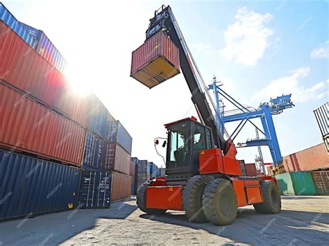 A Reach Stacker Lifting And Stacking Shipping Containers At A Container Terminal Premium Ai