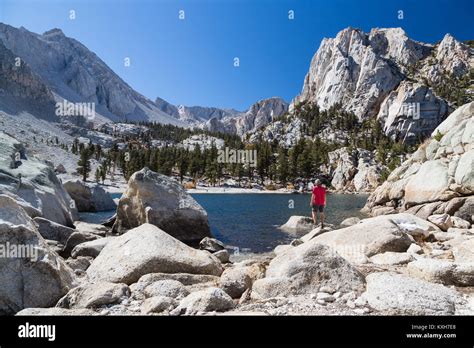 A Man Admires The View Of Lone Pine Lake Looking Up Towards The Sierra