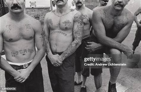 Prisoners Take A Break From Lifting Weights In The Excercise Yard Of
