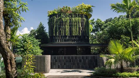 Plant Filled Timber Lattice Wraps Around Walls Of Singapore Home