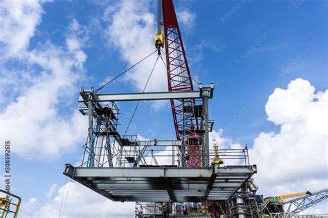 Offshore Crane On Board A Construction Work Barge Performing Heavy