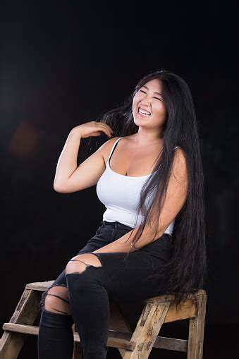Beautiful Curvy Model With Dark Hair And Cheerful Personality In A