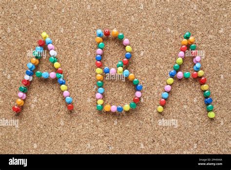 Applied Behavior Analysis Concept Corkboard With Abbreviation ABA Made Of Colorful Pins Stock
