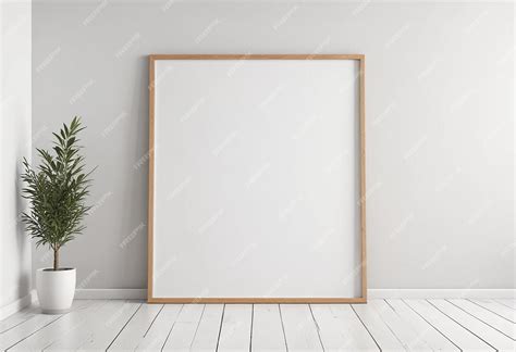 Premium Photo A Blank Canvas On A White Wall With A Wooden Frame In