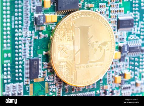 In The Motherboard Of A Computer The Coin Of Bitcoin Litecoin Like Concept Of Future And