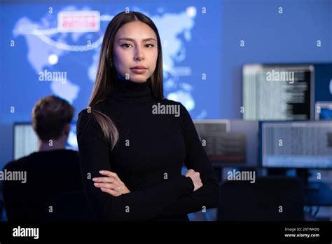 Serious Female Cybersecurity Analyst Or Manager In Large Cyber Security Operations Center SOC