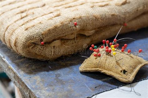 Pin Cushion And Raw Molded Padding Filled With Plant Fiber For A Seat In An Upholstery Workshop