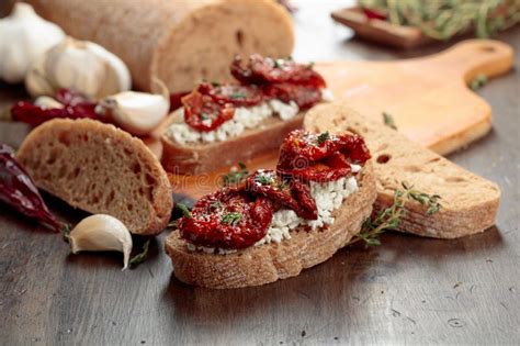 Bruschetta With Ricotta Sun Dried Tomatoes And Thyme Stock Image