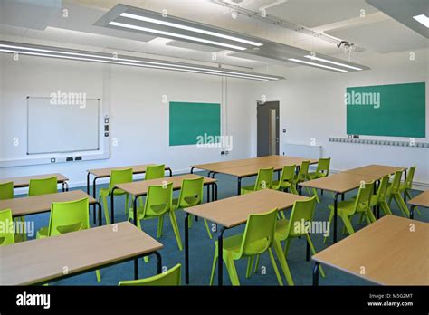 Classroom In A Newly Built London Primary School Shows Traditional Desk Arrangement Facing
