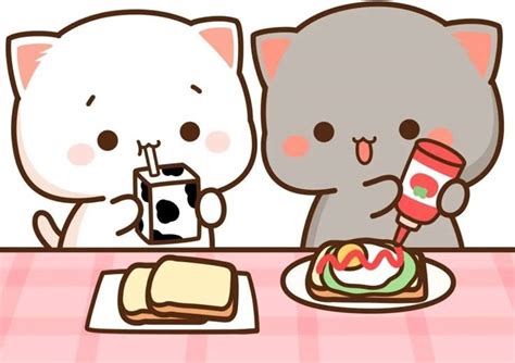 Two Cats Sitting At A Table With Food And Drink In Front Of Them One