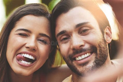 Couple Selfie And Tongue Out In Portrait Outdoor And Smile With Love