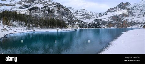 Oeschinen Lake With Its Iconic Turquoise Water In Winter Snow Landscape