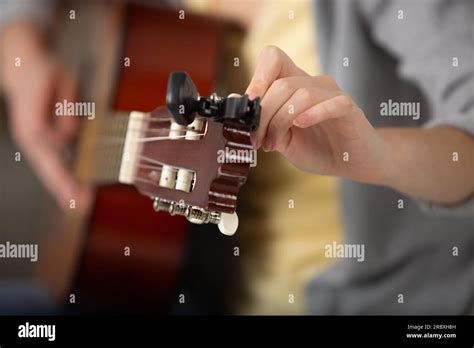 Guitar And Female Fingers Tuning Hi Res Stock Photography And Images Alamy