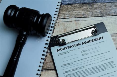 Concept Of Arbitration Agreement Write On Paperwork Isolated On Wooden