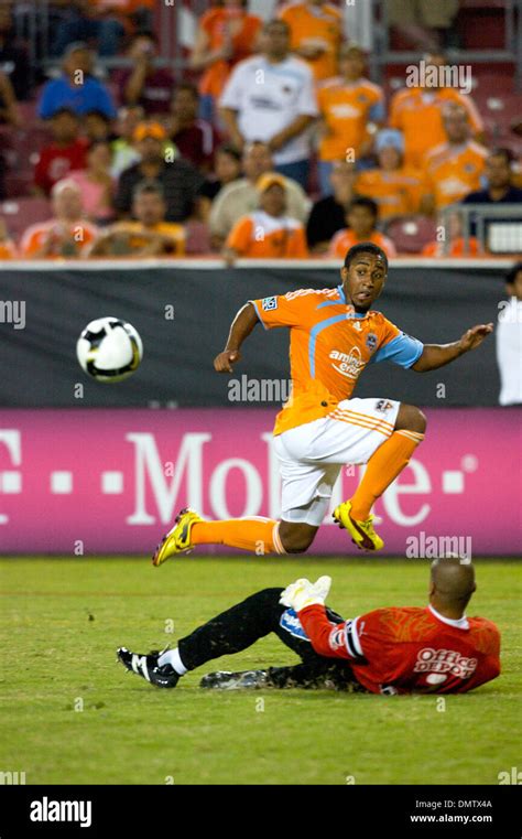 Corey Ashe 26 Midfielder Of The Houston Dynamo Chips The Ball To The Middle Of The Field