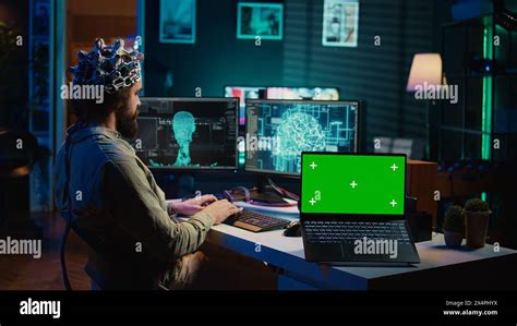 Engineer With Eeg Headset On Programming Brain Transfer Into Computer