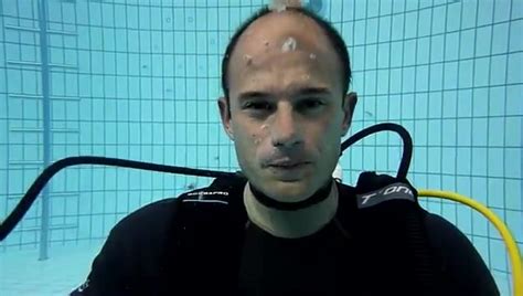 Barefaced Scubadiver Taking Reg Off Underwater