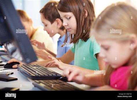 Portrait Of Lovely Babegirl Looking At Computer Keyboard While Typing Stock Photo Alamy