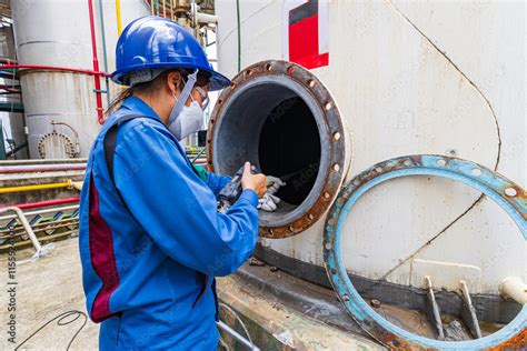 Worker Female Hand Holding Gas Detector Inspection Safety Gas Testing At Front Manhole Tank
