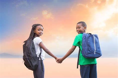 Premium Photo Cute Pupils Holding Hands Against Desert Landscape