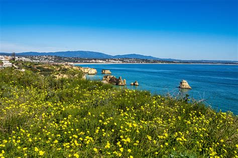 Ponta Da Piedade Is A Unique Rock Formation With Famous Grottos In The