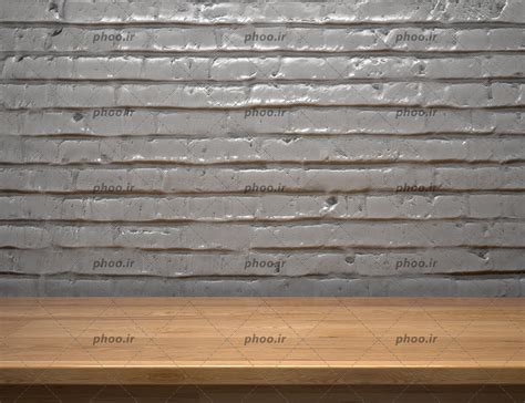 عکس میز چوبی در پس زمینه دیوار عکس با کیفیت و تصاویر استوک حرفه ای