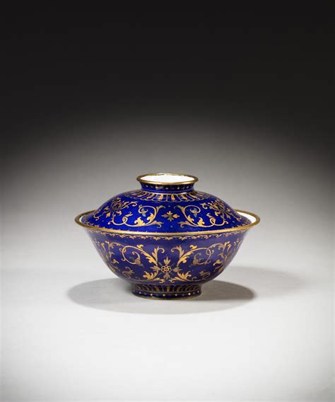 A Gilt Decorated Basse Taille Blue Enamel Cup And Saucer Seal Mark And