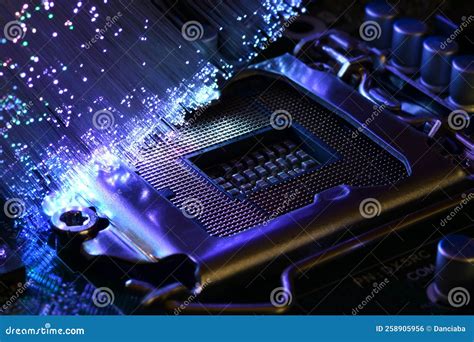 Detail Of Socket Of CPU On A PC Motherboard Illuminated By A Bunch Of Colored Fiber Optics High