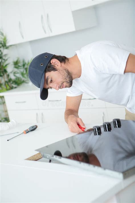 Man Disassembling Hob Stock Photo Image Of Laborer 248310424