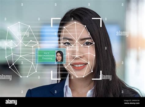 asian women using face detection and recognition technology for access