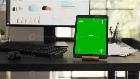 Workstation With Greenscreen On Tablet In Agency Coworking Space Running Isolated Chromakey