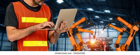 Engineer Use Advanced Robotic Software Control 스톡 사진 1963265581
