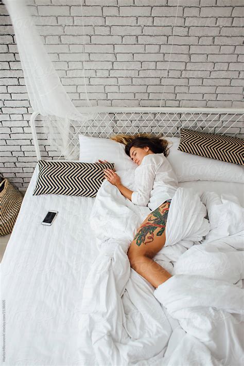 Woman Sleeping In Bed By Stocksy Contributor Marko Stocksy