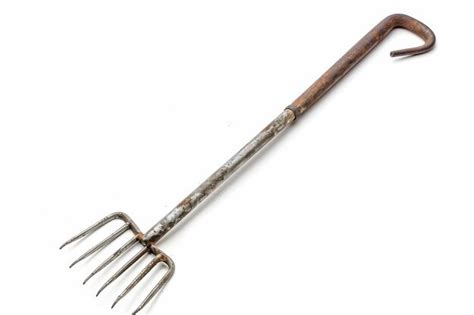 Sleek Silver Pitchfork With Wooden Handle Premium Ai Generated Image