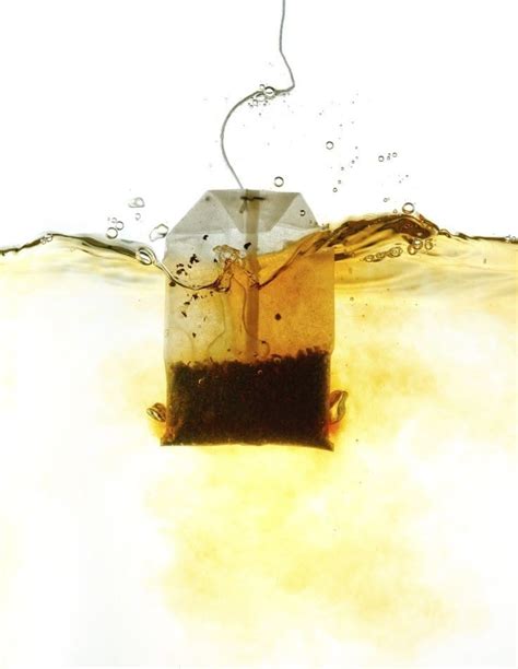 Ginger And Peppermint Tea With Floating Origami Tea Bag Suspended In