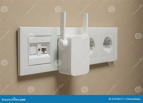 Wireless Wi Fi Repeater In Power Socket On Beige Wall Stock Image Image Of Access Electrical