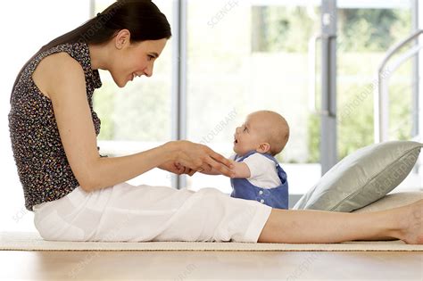 Mother Playing With Baby Stock Image C Science Photo Library