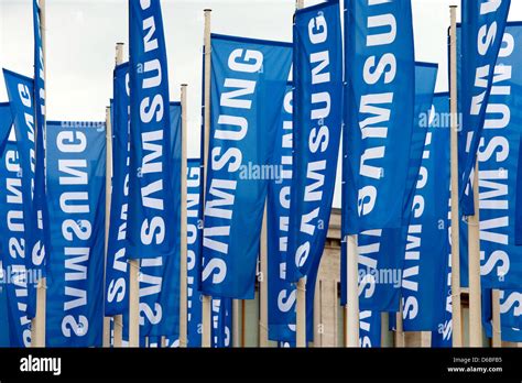 Flags Of South Korean Group Samsung Flutter In The Wind At The