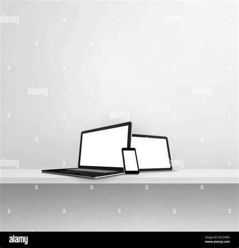 Laptop Mobile Phone And Digital Tablet Pc On White Concrete Wall Shelf Square Background Stock