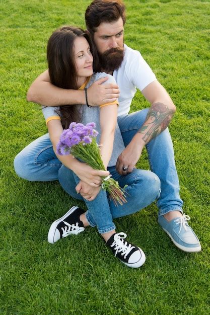 Premium Photo Carefree Couple In Love Cuddling Relax In Park Tender