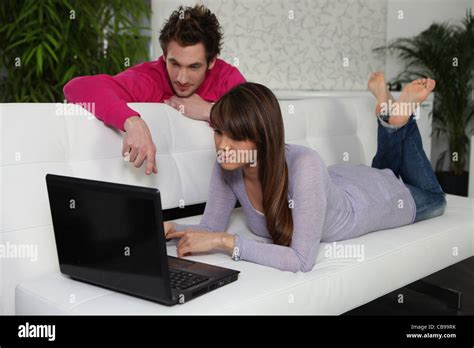 Man And Woman In Front Of A Laptop Computer Stock Photo Alamy