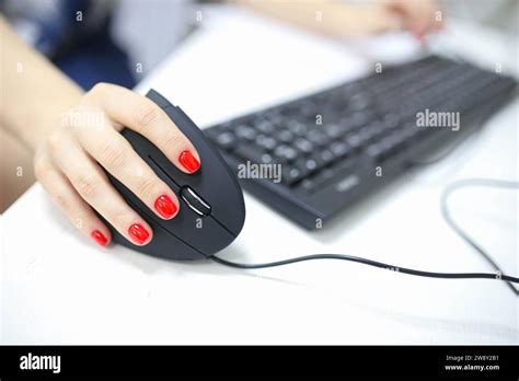 Girls Hand Uses A Vertical Ergonomic Joystick Of A Computer Mouse