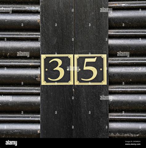 Metal Shop Front Shutter With Number 35 Stock Photo Alamy