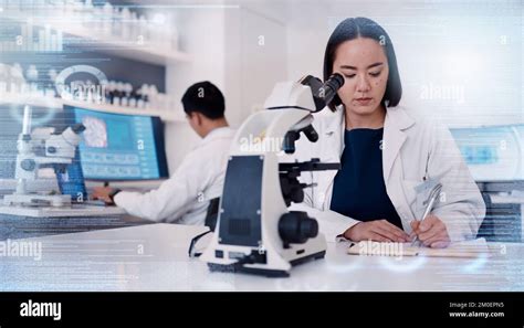 Scientist In Laboratory Asian Woman In Science With Microscope And Report Analytics Of Research